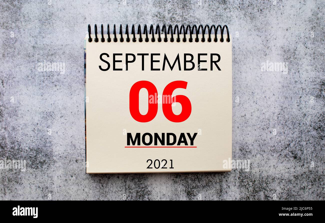 Text and numbers on wooden block cube and paper stand frame - Labor day ...