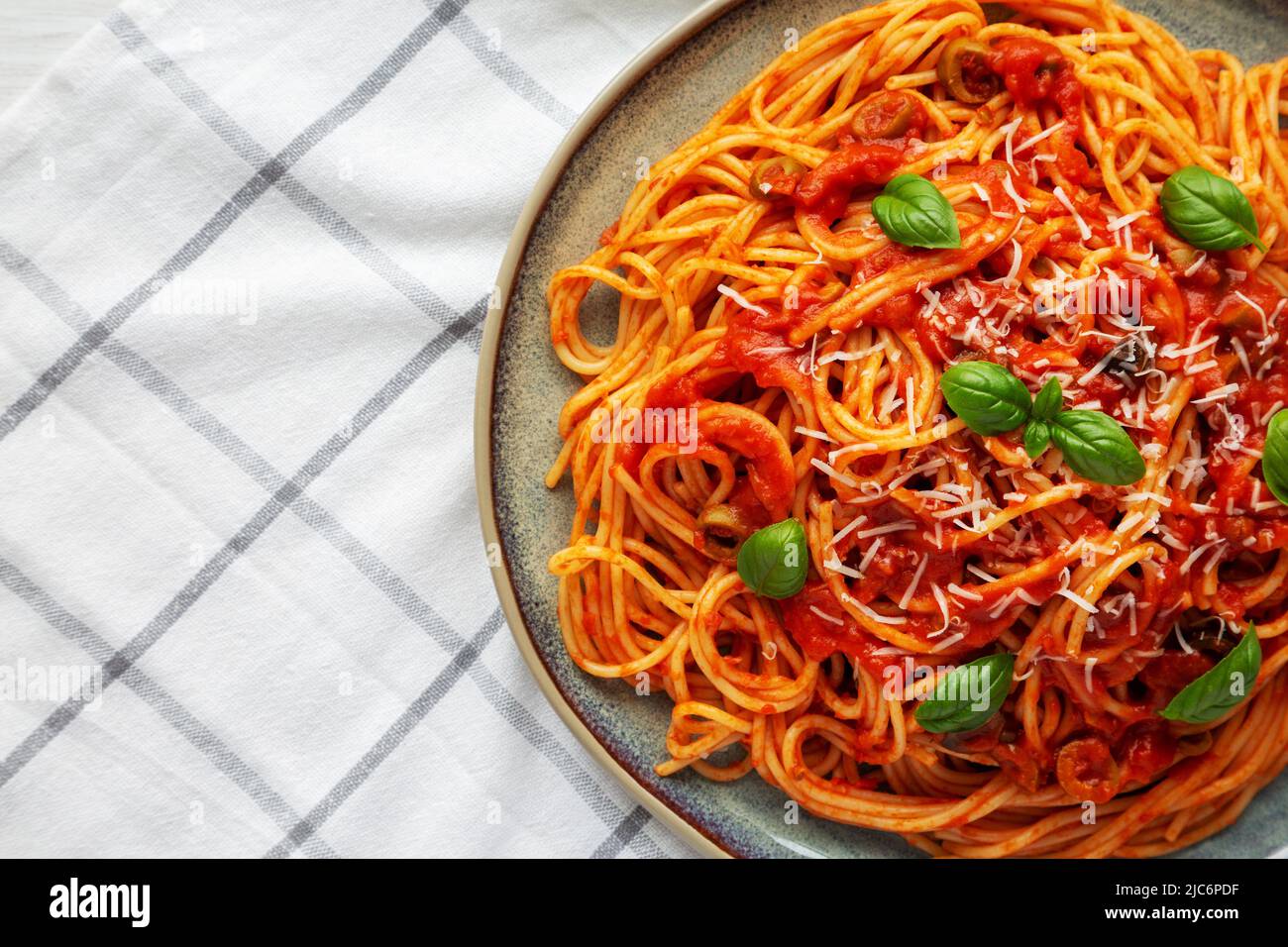 Homemade Spaghetti with Olives and Tomato Sauce, top view. Flat lay ...