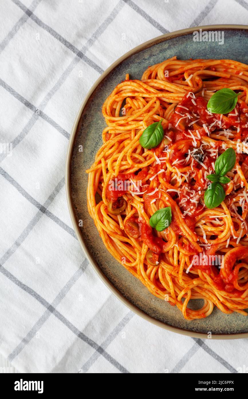 Homemade Spaghetti with Olives and Tomato Sauce, top view. Flat lay ...