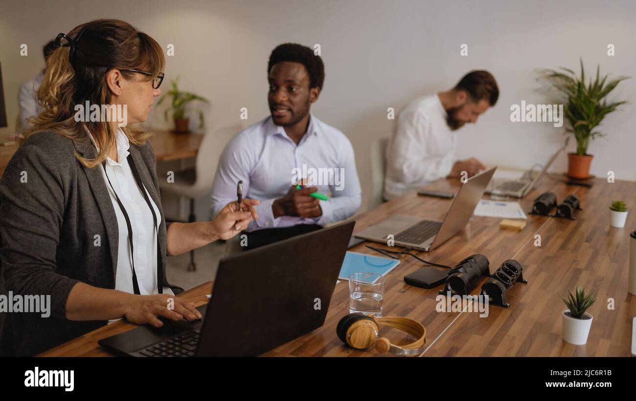 Business team of diverse people doing strategic planning work inside ...