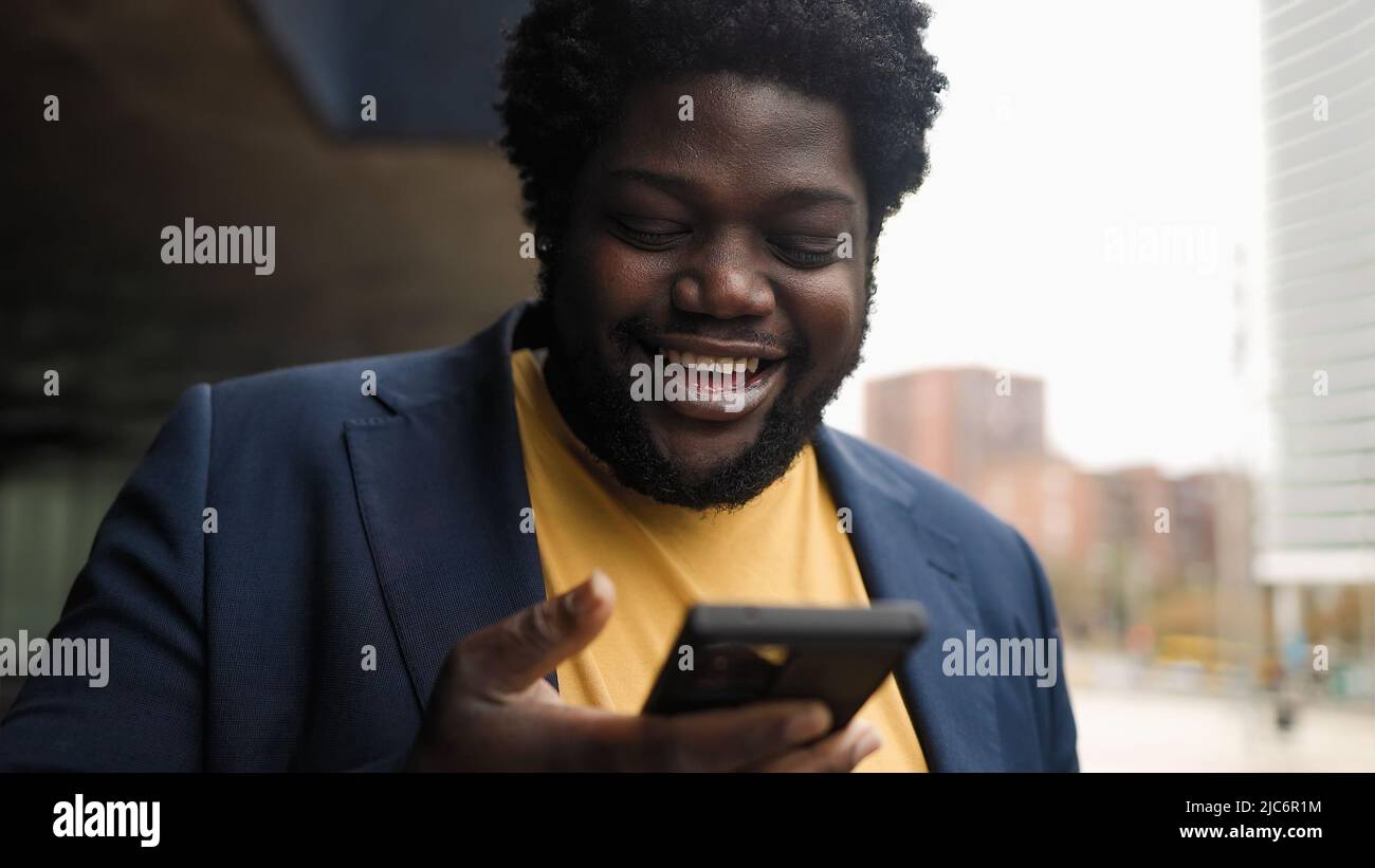 Young man using smartphone app hi-res stock photography and images - Alamy