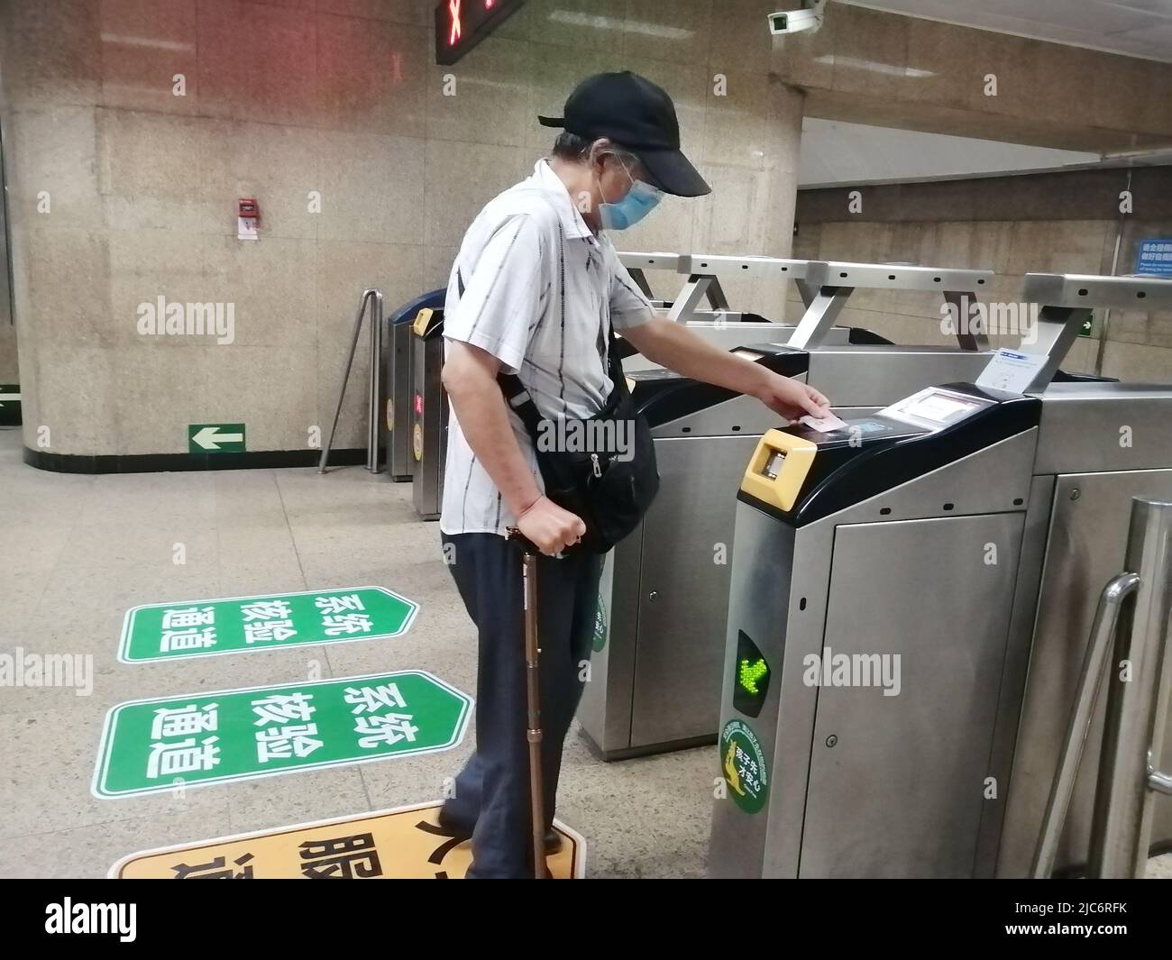 BEIJING, CHINA - JUNE 9, 2022 - Passengers swipe their cards to pass ...