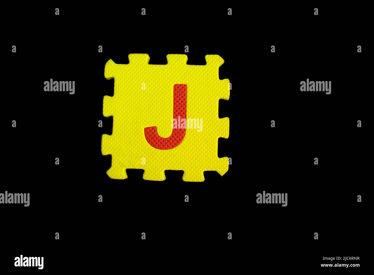 Colorful alphabet puzzle isolated on black background. alphabet ...