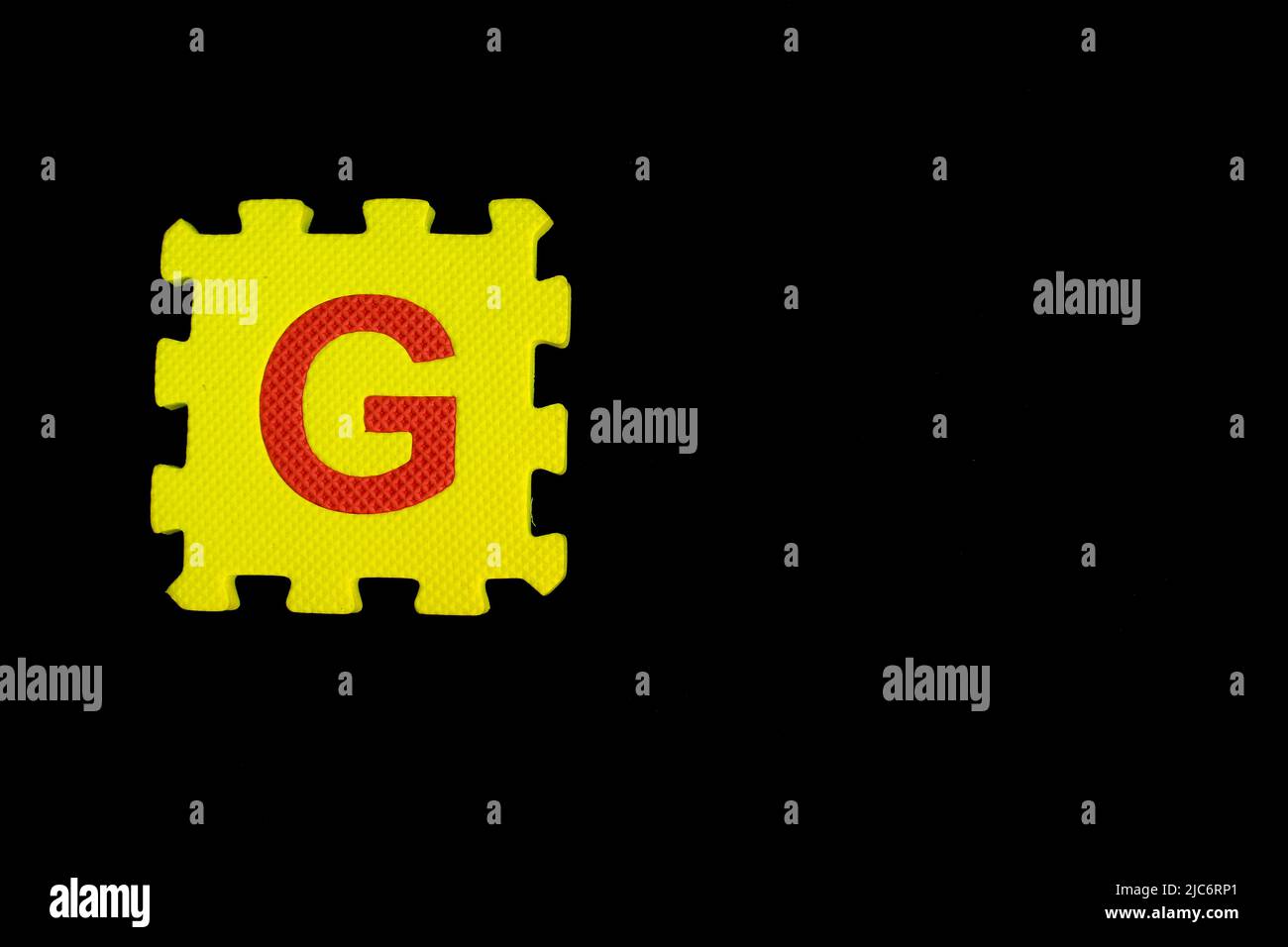 Colorful alphabet puzzle isolated on black background. alphabet ...