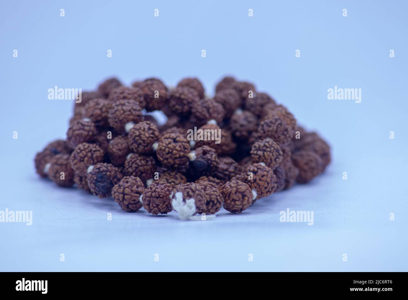 Holy 108 rudraksha beads on white background Stock Photo - Alamy