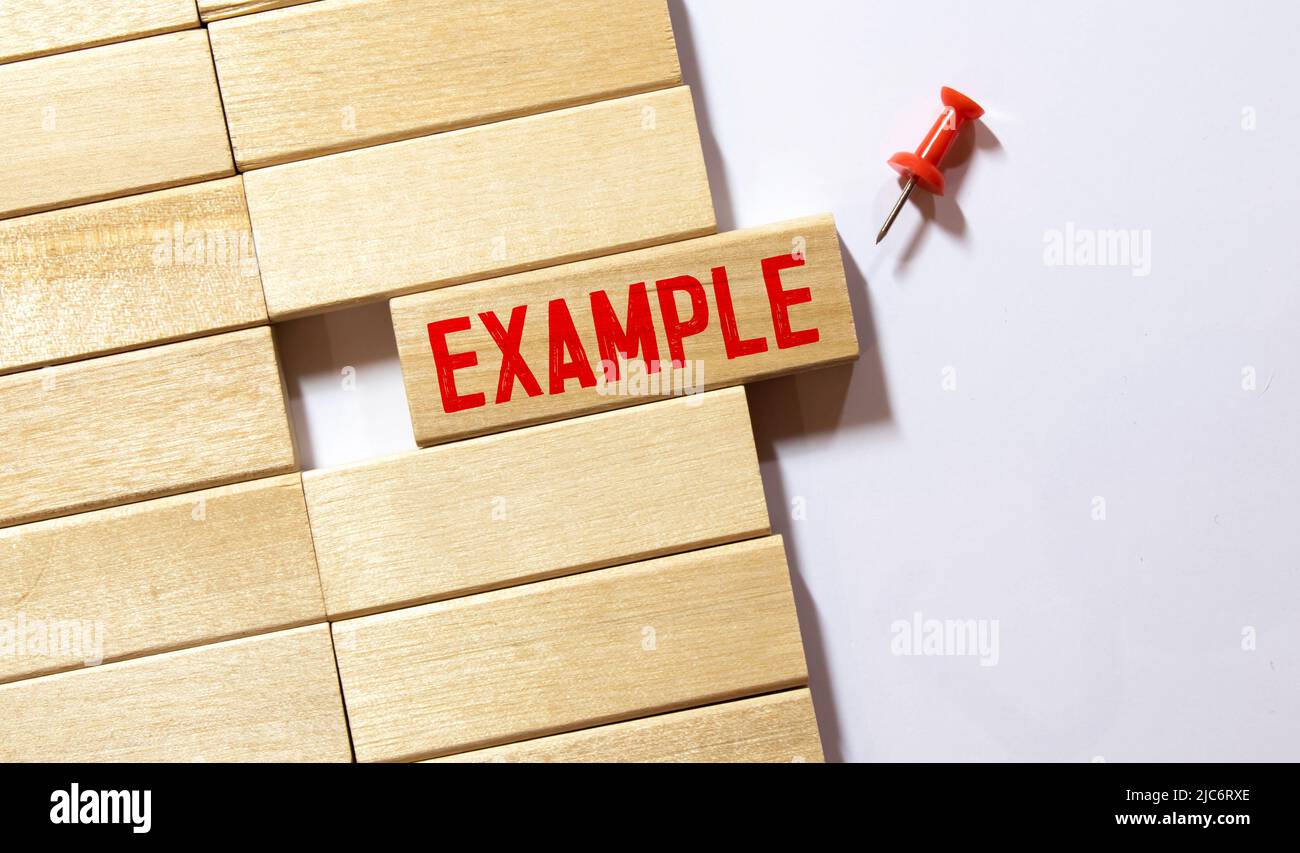 Wooden block form the word 'examples' on beautiful canvas background ...