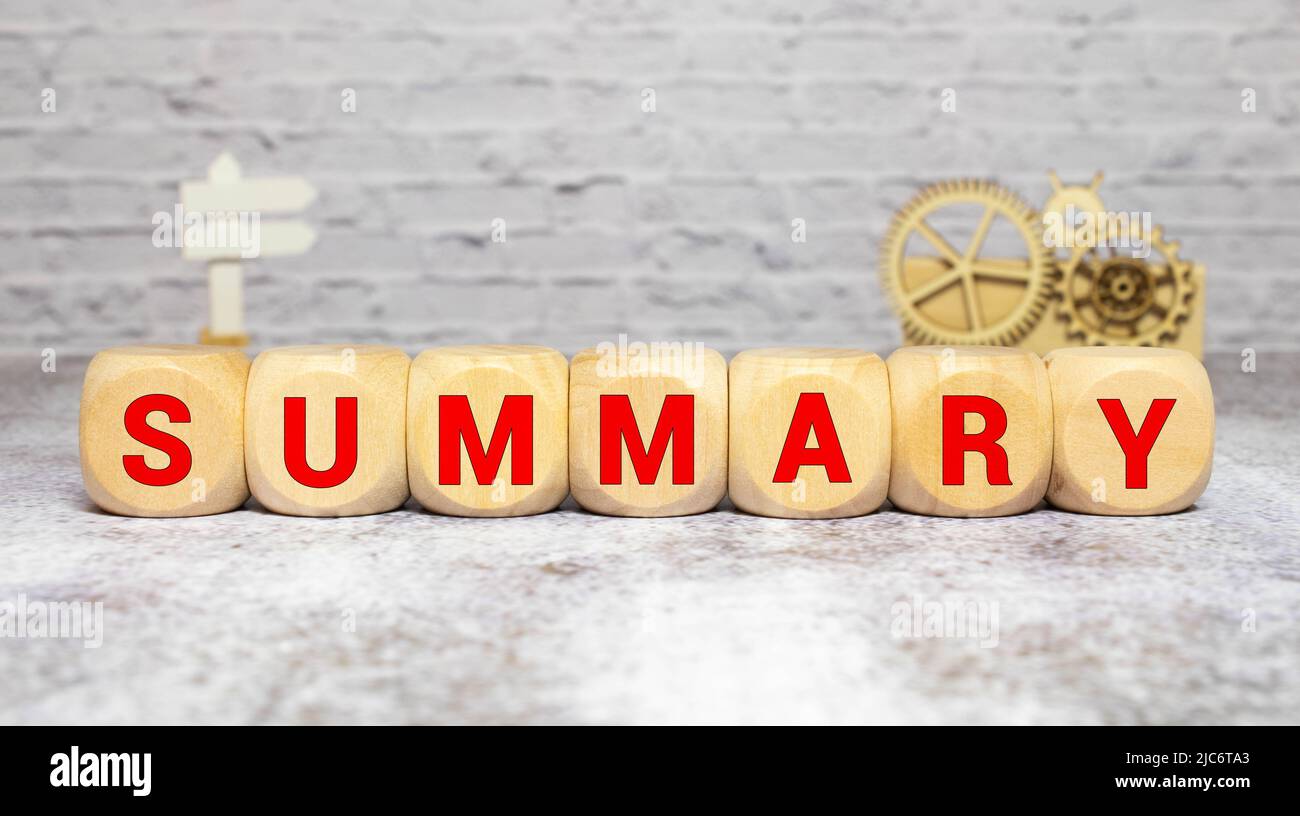Summary word from wooden blocks on desk Stock Photo - Alamy