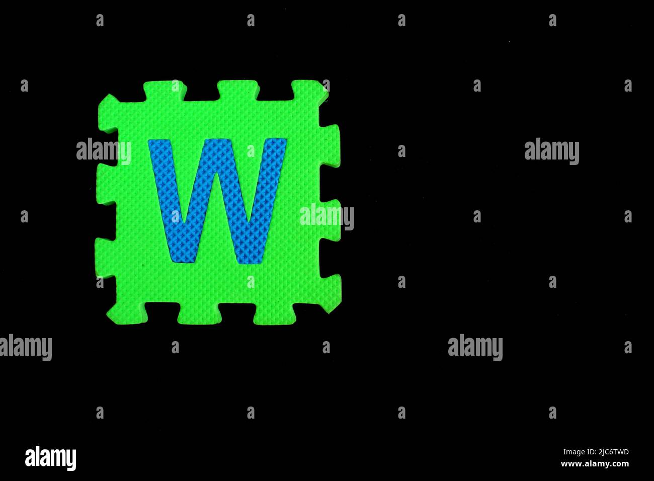 Colorful alphabet puzzle isolated on black background. alphabet ...