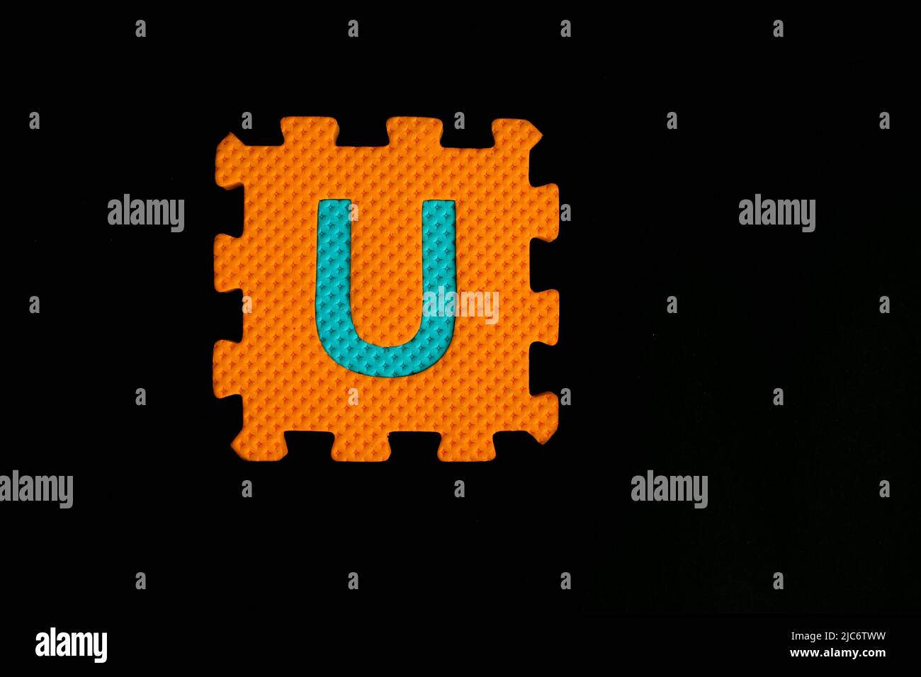 Colorful alphabet puzzle isolated on black background. alphabet ...