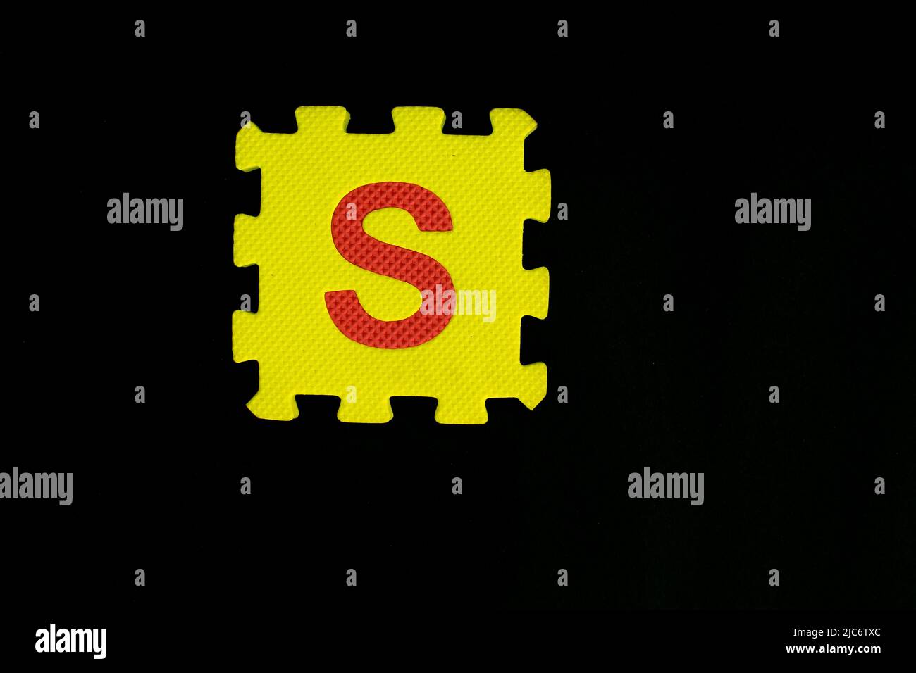Colorful alphabet puzzle isolated on black background. alphabet ...