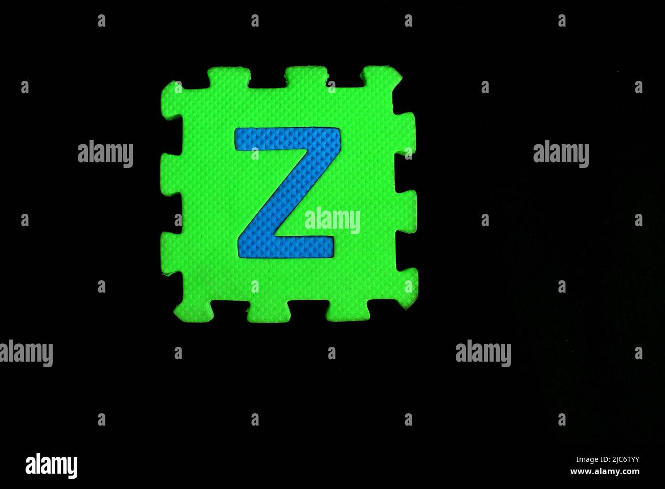 Colorful alphabet puzzle isolated on black background. alphabet ...