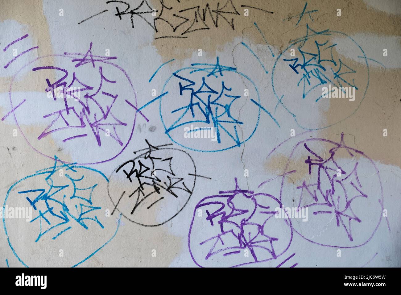 Graffiti tags defacing a wall in a shelter in Newquay in Cornwall in ...