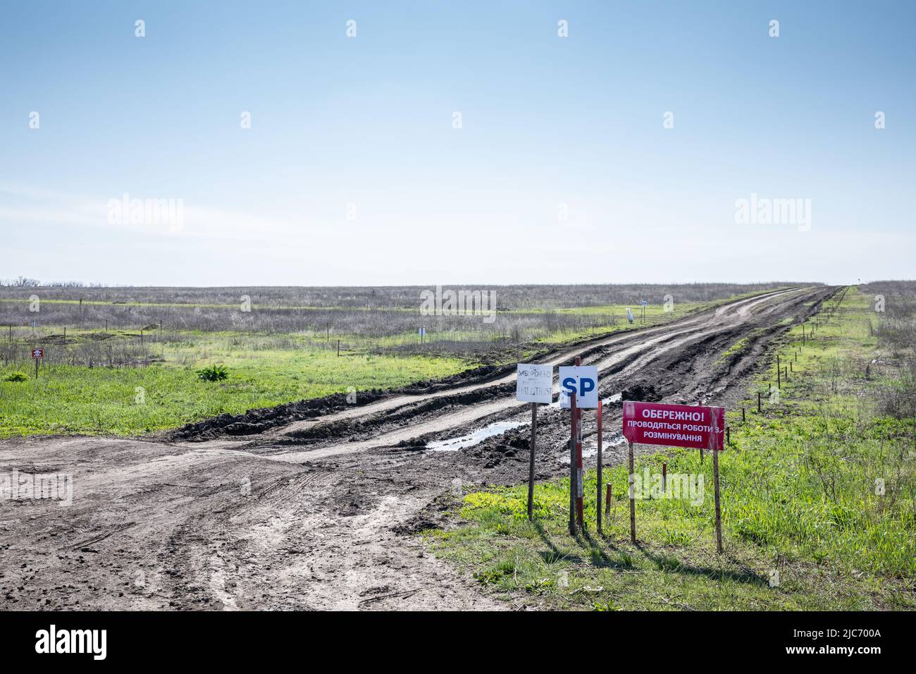 A sign announcing mined territory and a war line. Avdiivka, Donetsk ...
