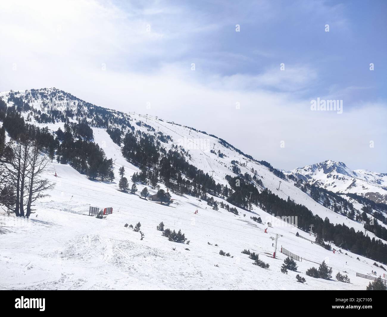 Beautiful view of ski resort with pistes ski lift and forest mountains ...