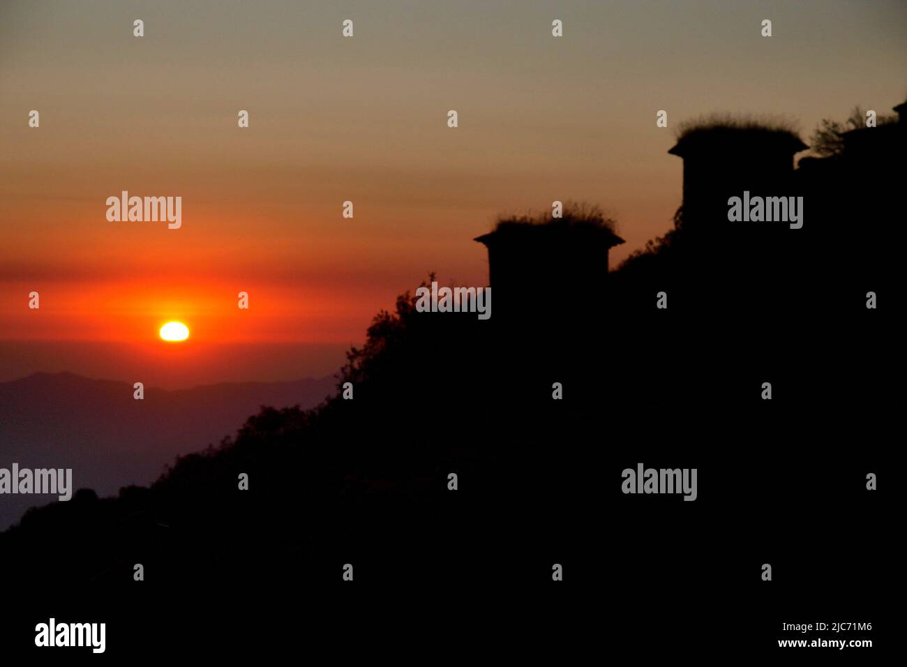 Sunset at the ruins of the stone citadel of Rupac in the Peruvian Andes ...
