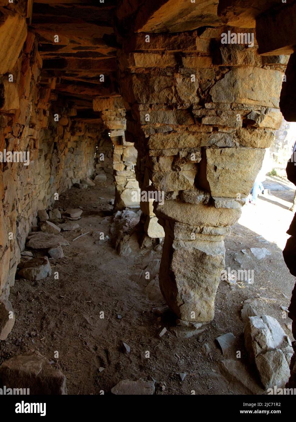 Pillars of the ruins of the stone citadel of Rupac in the Peruvian ...
