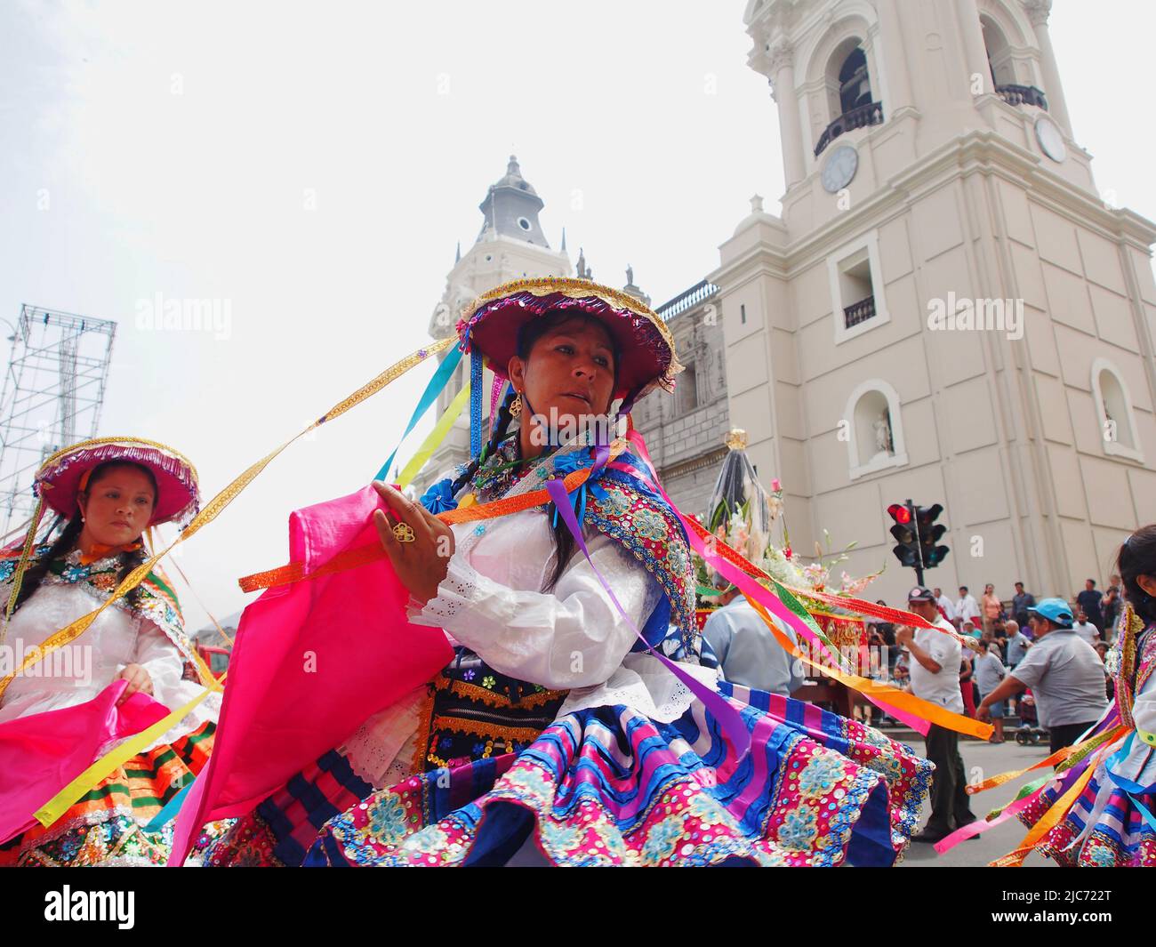 Women in typical costumes dancing in the procession. Hundreds of people ...