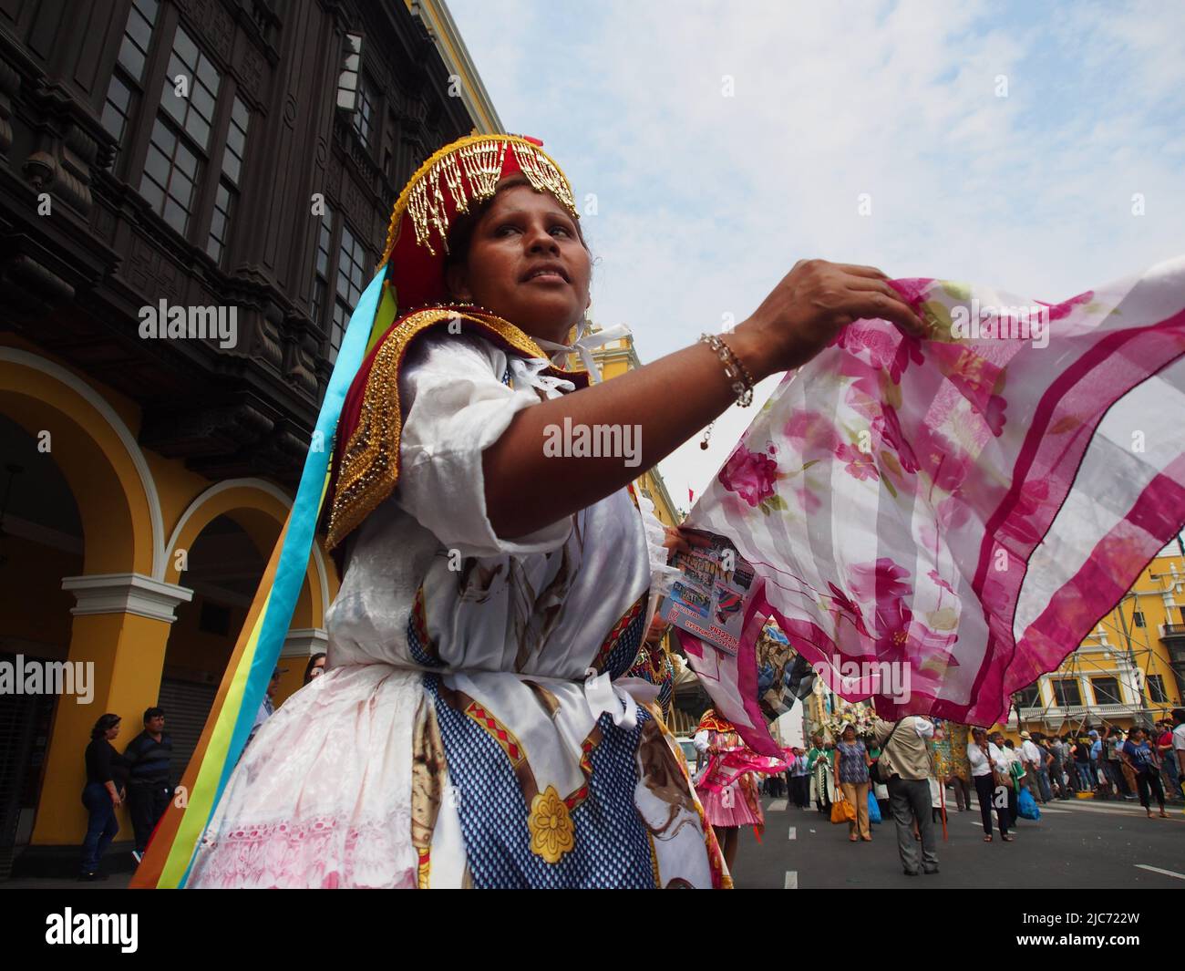 Women in typical costumes dancing in the procession. Hundreds of people ...