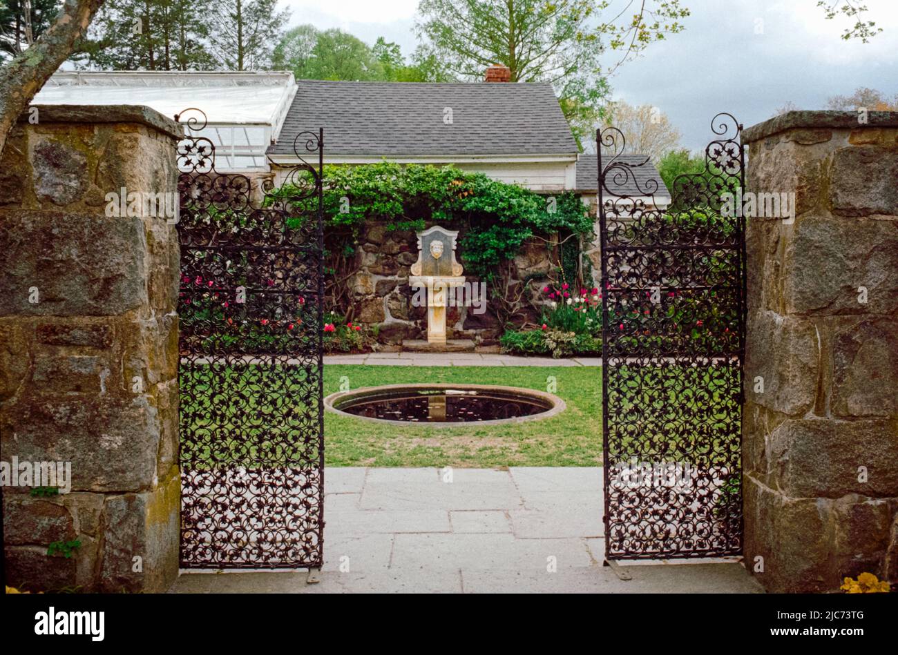 A fountain, pool and gate to garden at the Stevens-Coolidge house and ...