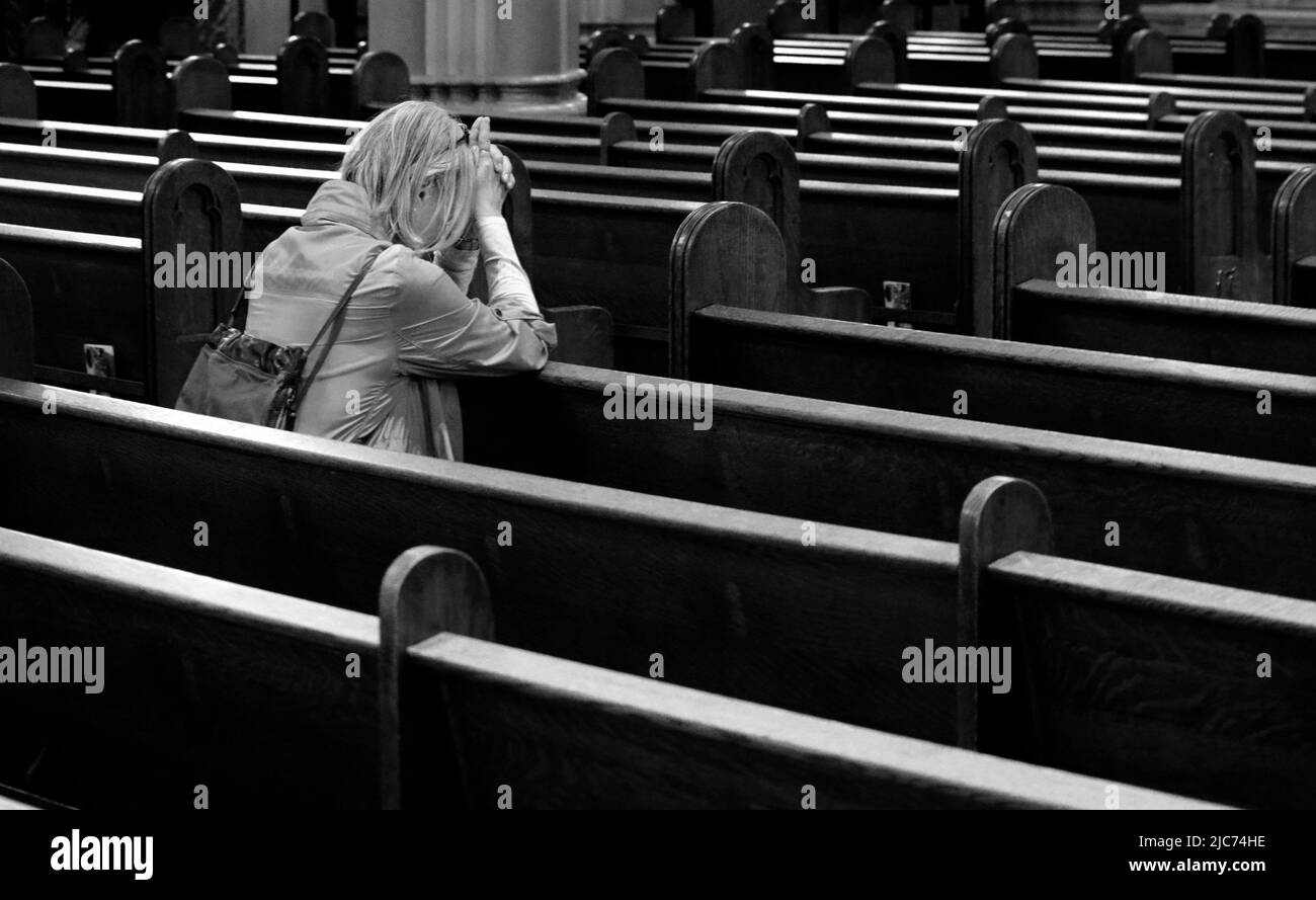 Praying alone catholic church hi-res stock photography and images - Alamy