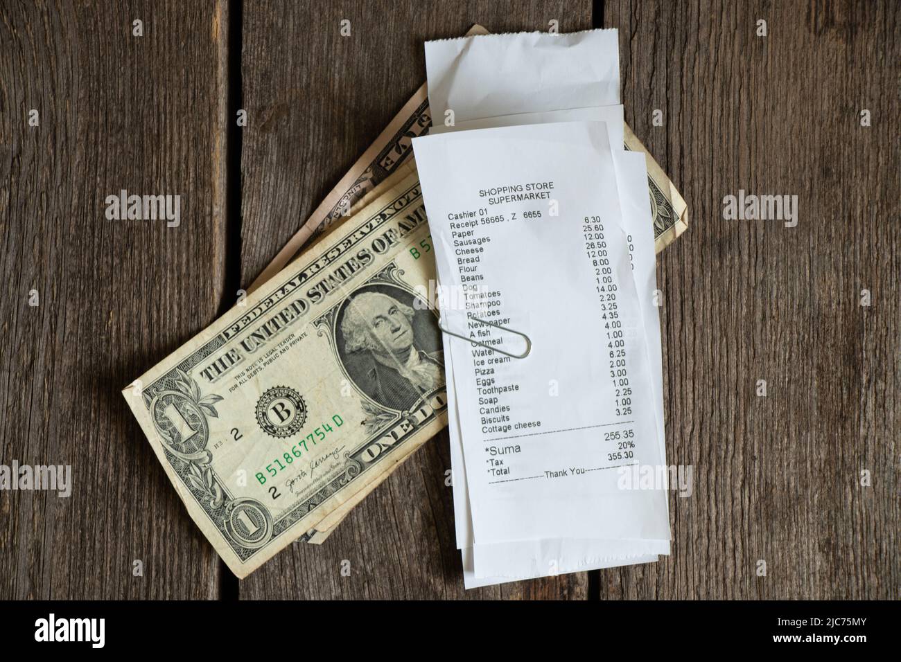 a check from the supermarket is on the table, a paper check with ...