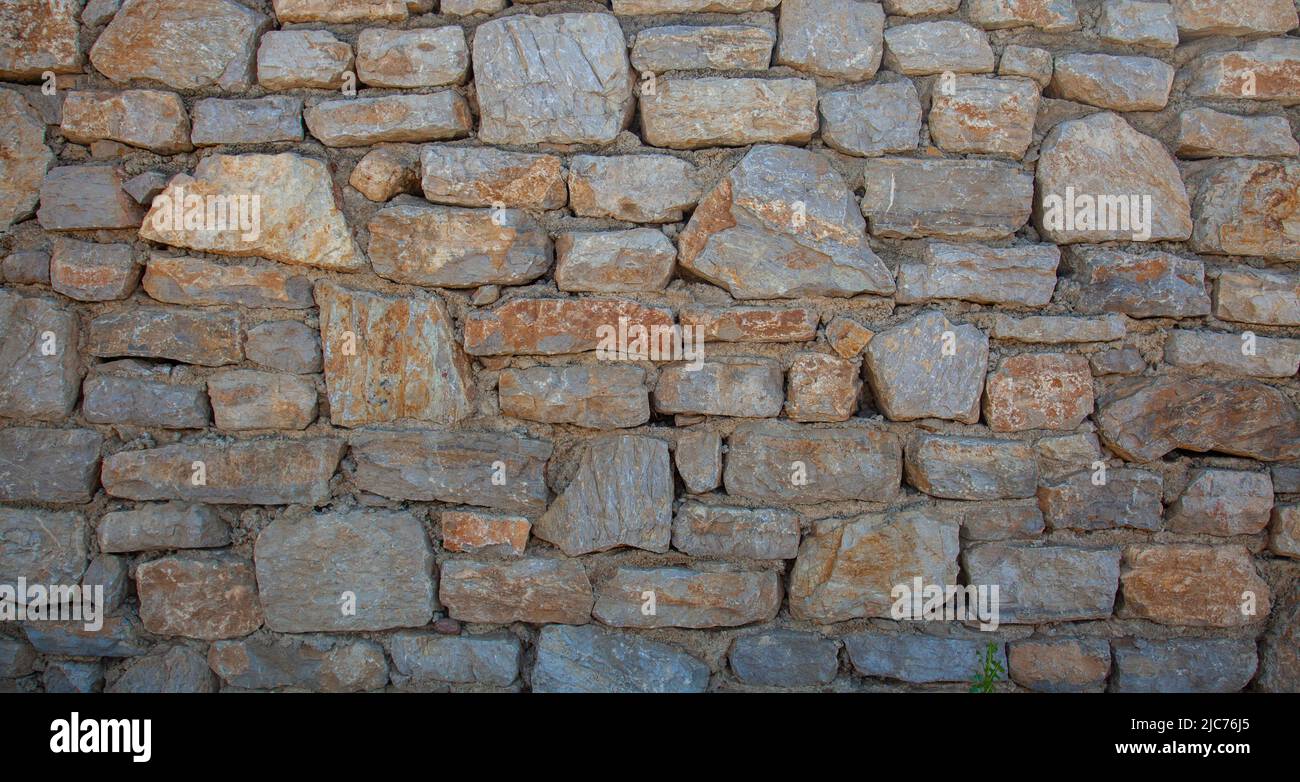 Stone wall textured. Front view Stock Photo - Alamy