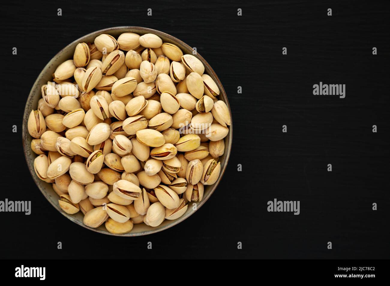 Roasted and Salted Pistachio in Shell. Space for text Stock Photo - Alamy