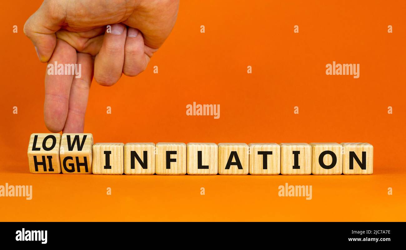 High or low inflation symbol. Businessman turns cubes and changes ...