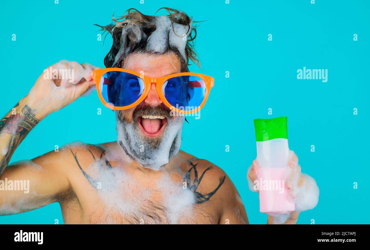 Smiling Man In Funny Big Glasses With Shampoo Bottle Bearded Guy In