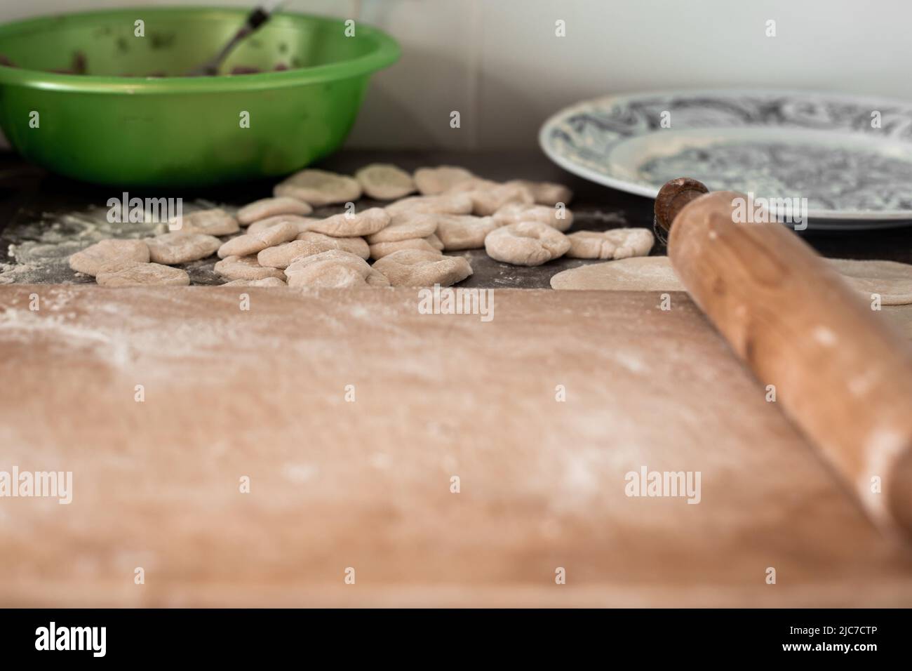 Preparation Of Dumplings Meat Filling In A Cup Dough Dumplings And A Board With A Rolling Pin