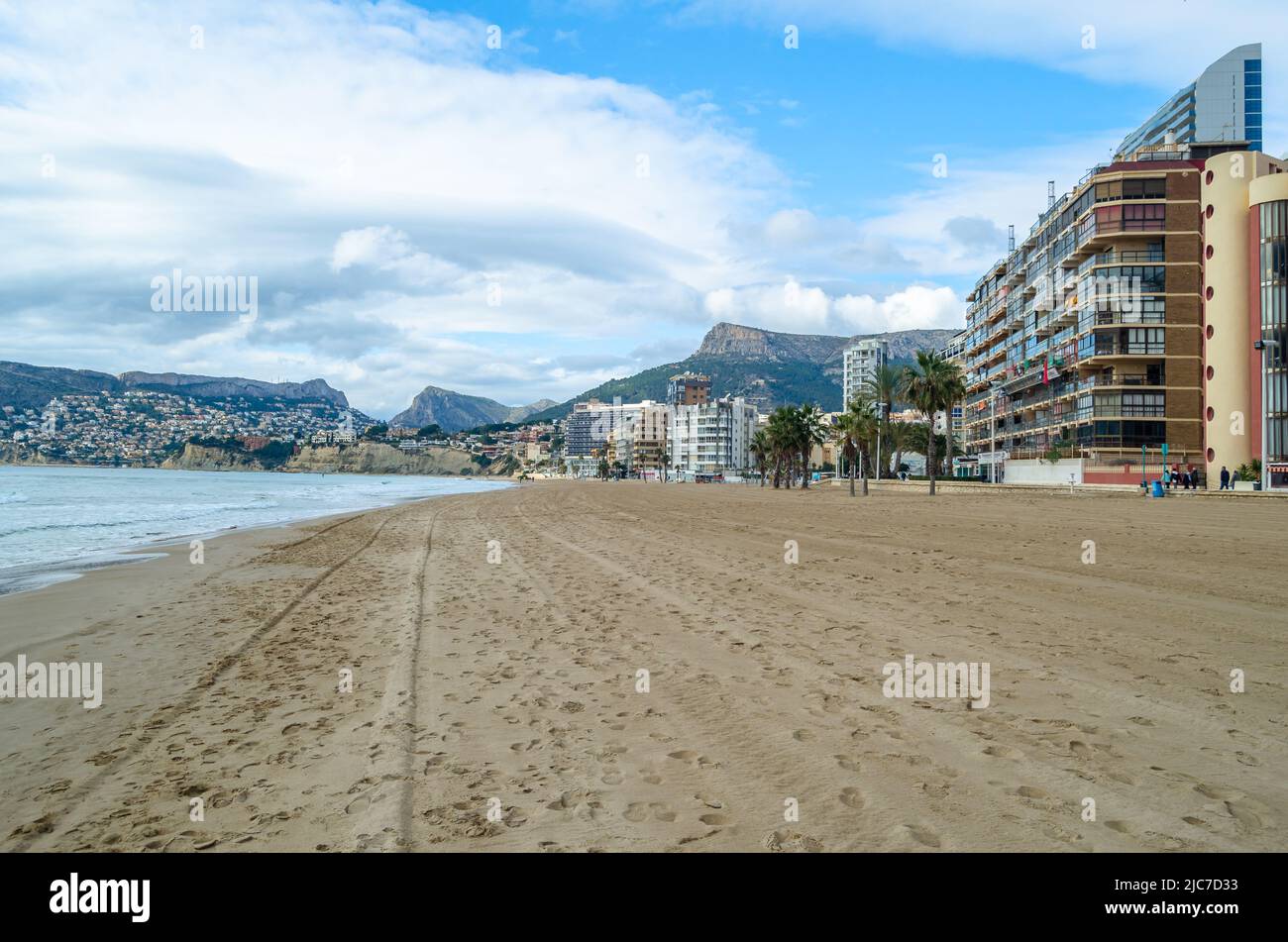 CALPE, SPAIN - JANUARY 24, 2022: People walking on the beach of Calpe ...