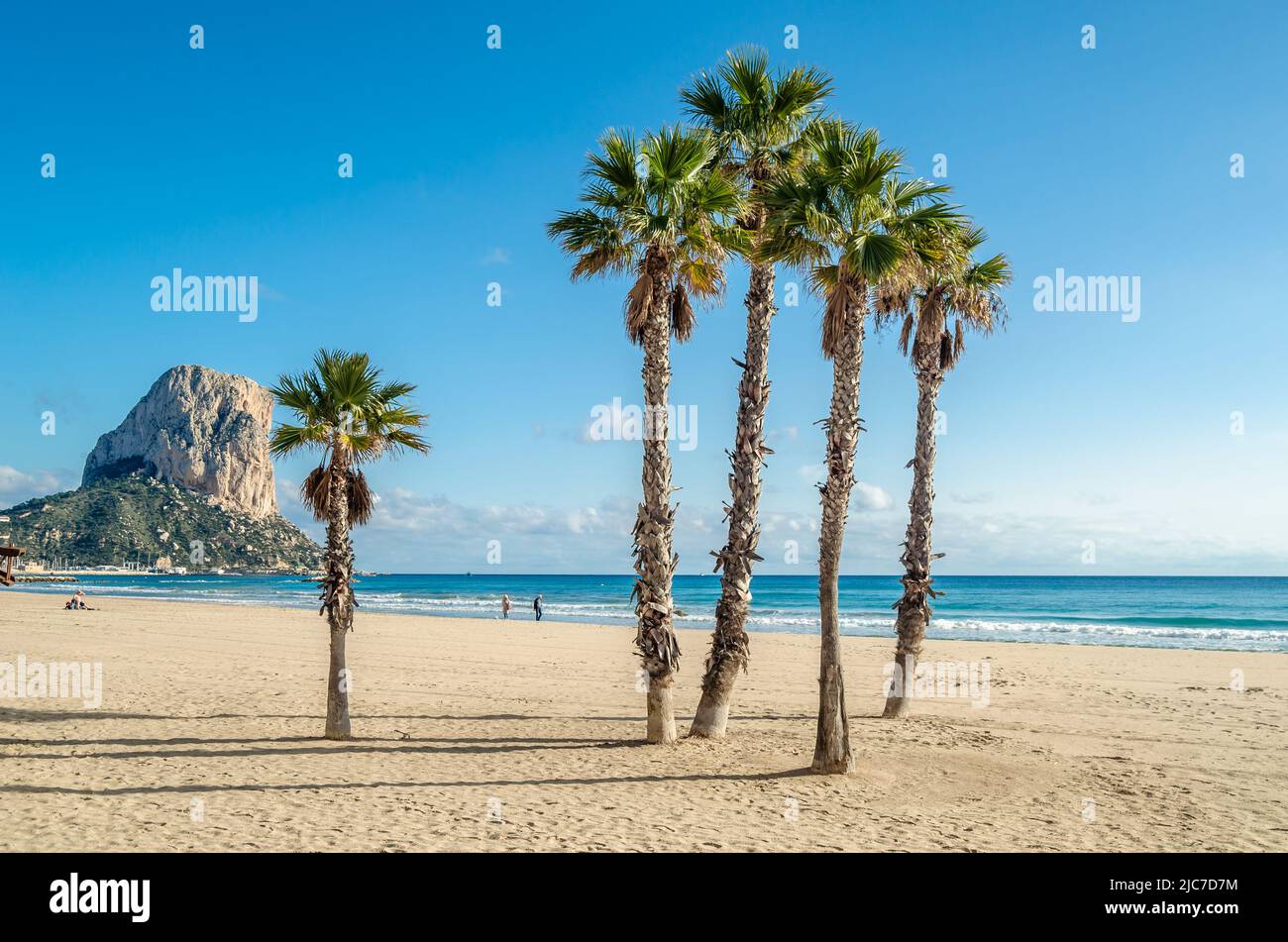 CALPE, SPAIN - JANUARY 26, 2022: People walking on the beach of Calpe ...