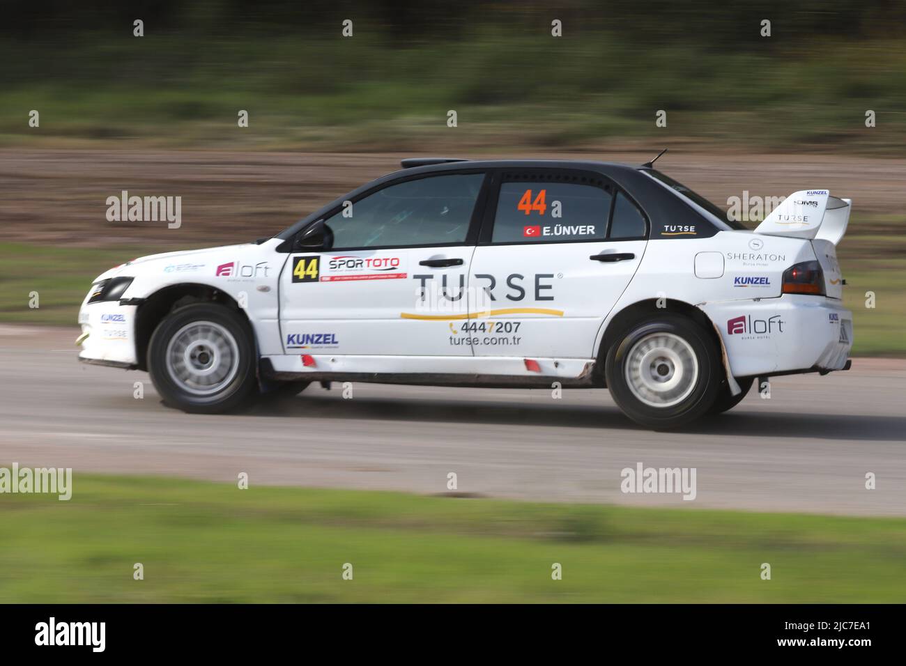 KOCAELI, TURKEY - DECEMBER 26, 2021: Efe Unver drives Mitsubishi Lancer ...
