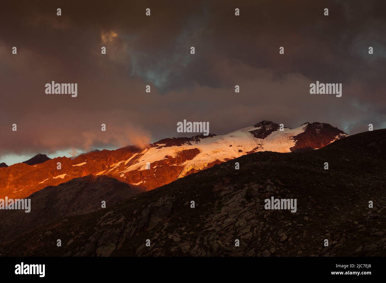 Dramatic sunset colors on peaks around the Fontana glacier, Alto Adige ...