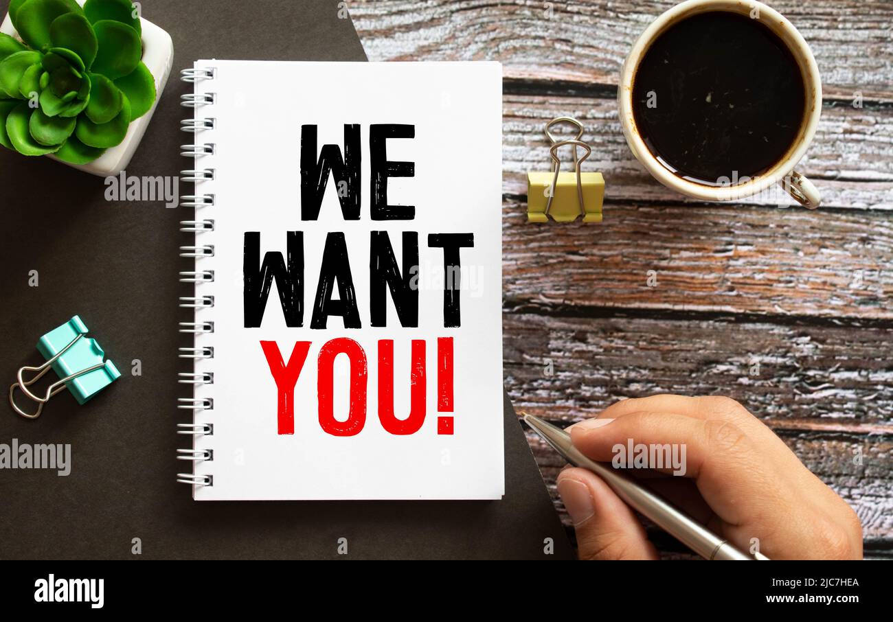 Coffee on the table with note writing we want you Stock Photo - Alamy