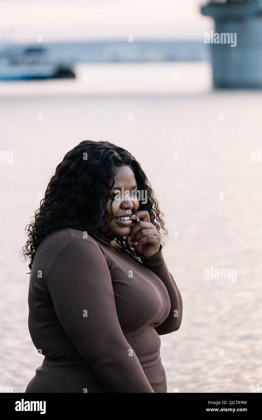 Vertical Black Haired Smiling Plump African Afro American Interracial