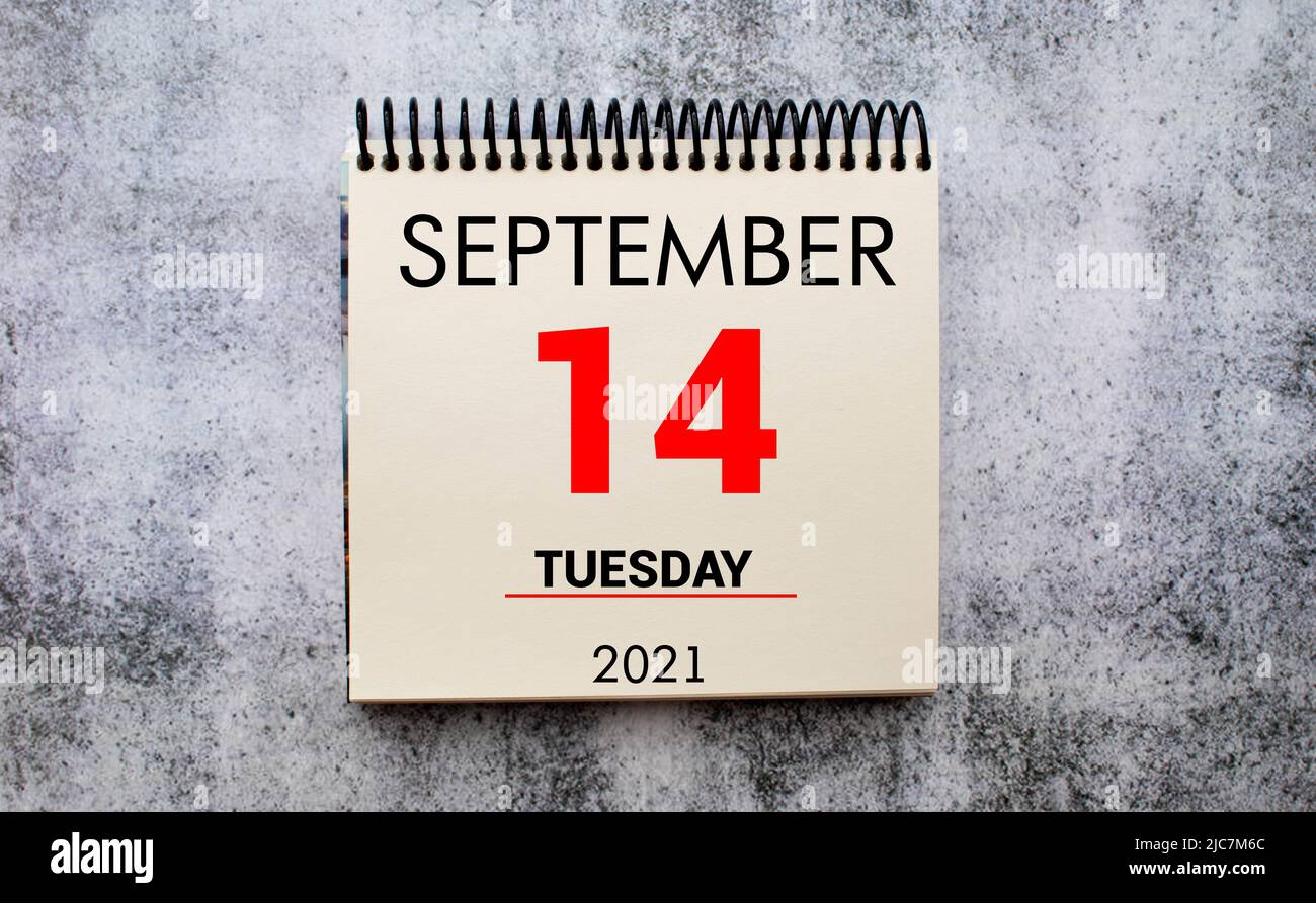 September 14th. Day 14 of month, color sticker calendar on notice board ...