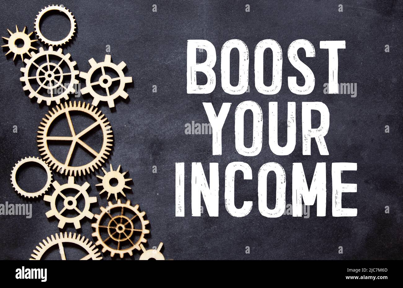 text BOOST YOUR INCOME on black background Stock Photo - Alamy