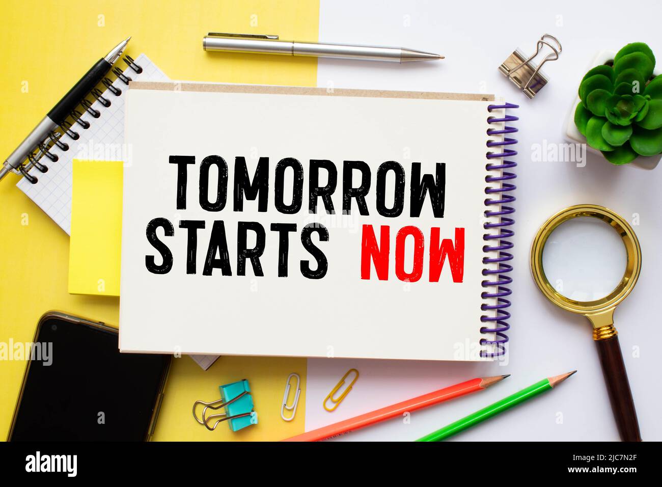 text Tomorrow starts now on white paper Stock Photo - Alamy