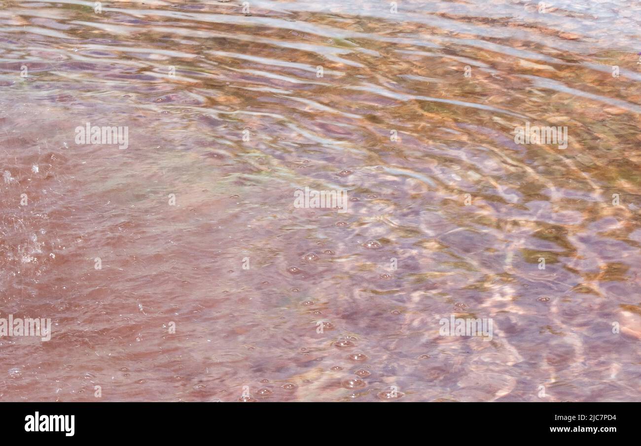Ripple water in swimming pool sun reflection Stock Photo - Alamy