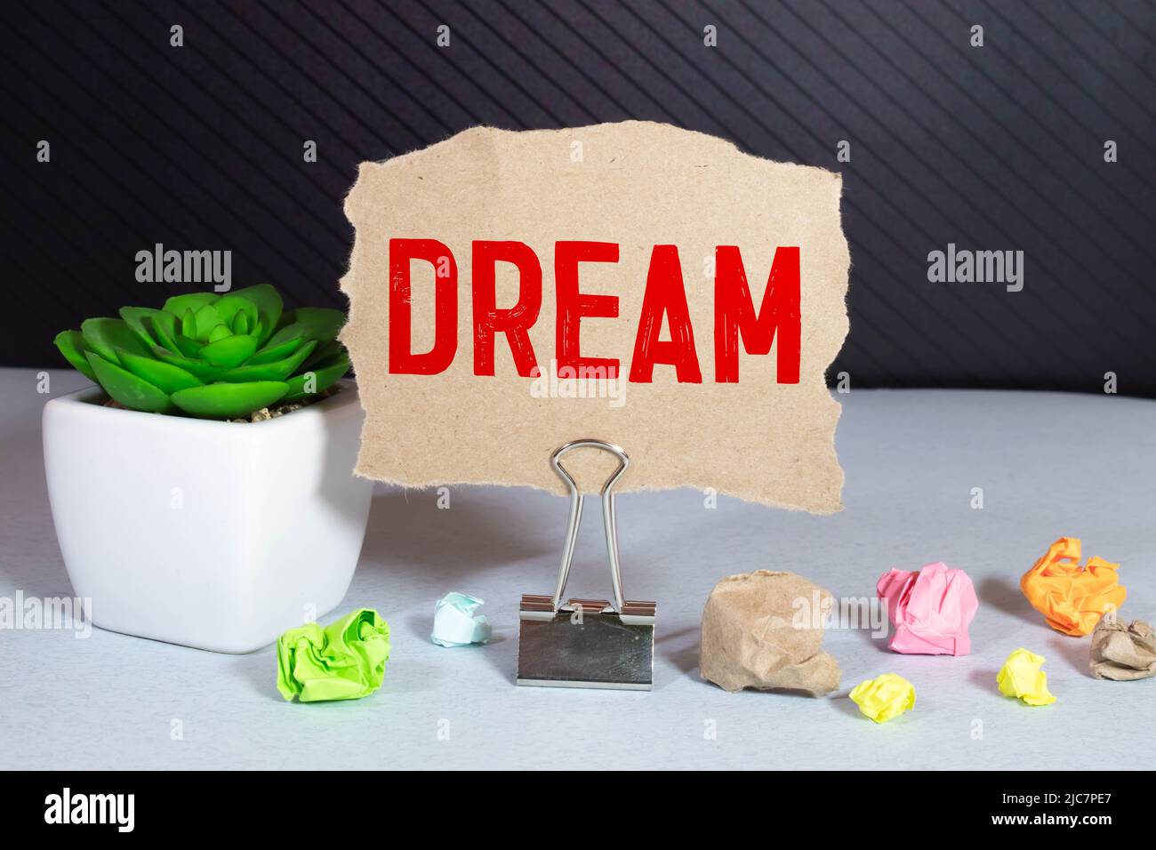 dare to dream, motivational slogan, colorful sticky notes on cork ...