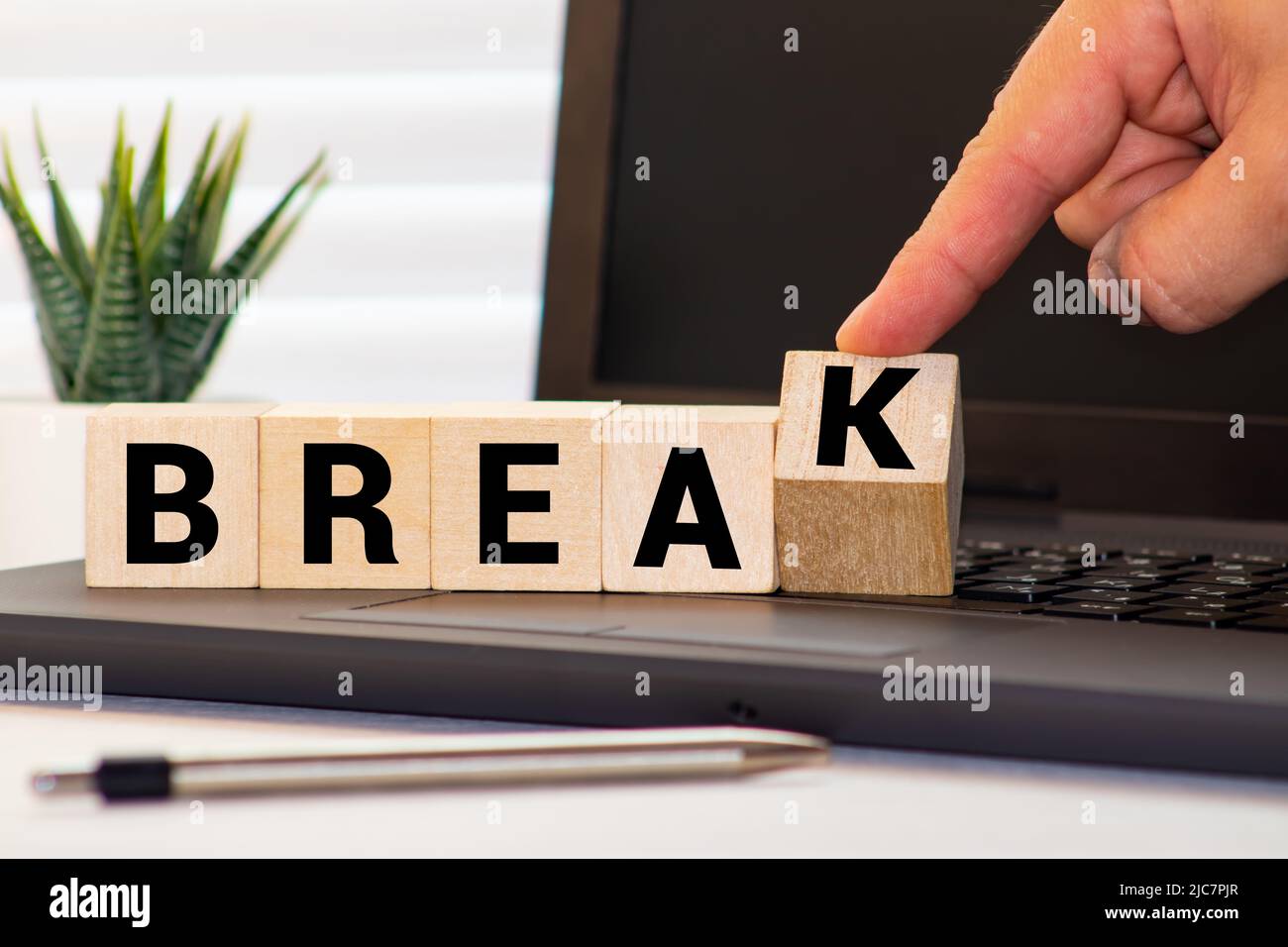 word break written with wood cubes on black background Stock Photo - Alamy