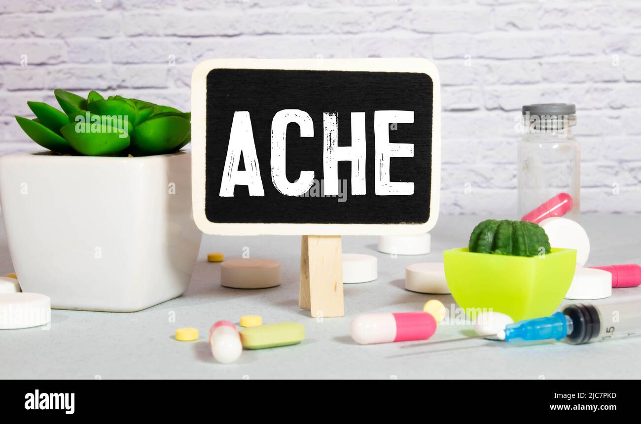 Wooden block form the word Ache with stethoscope on the doctor's ...