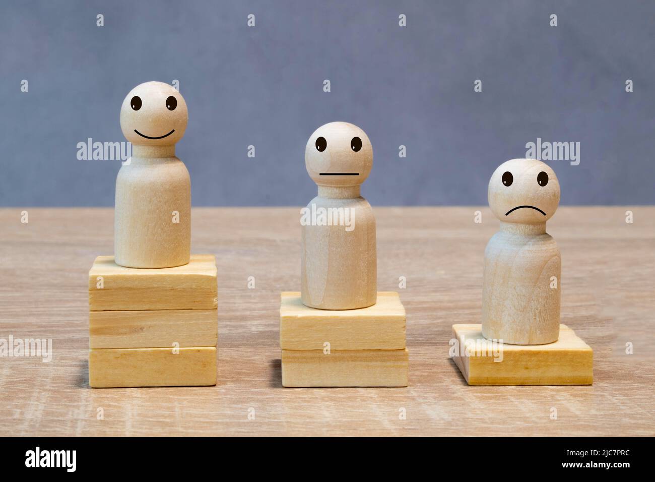 A wooden figure with sad and happy face Stock Photo - Alamy