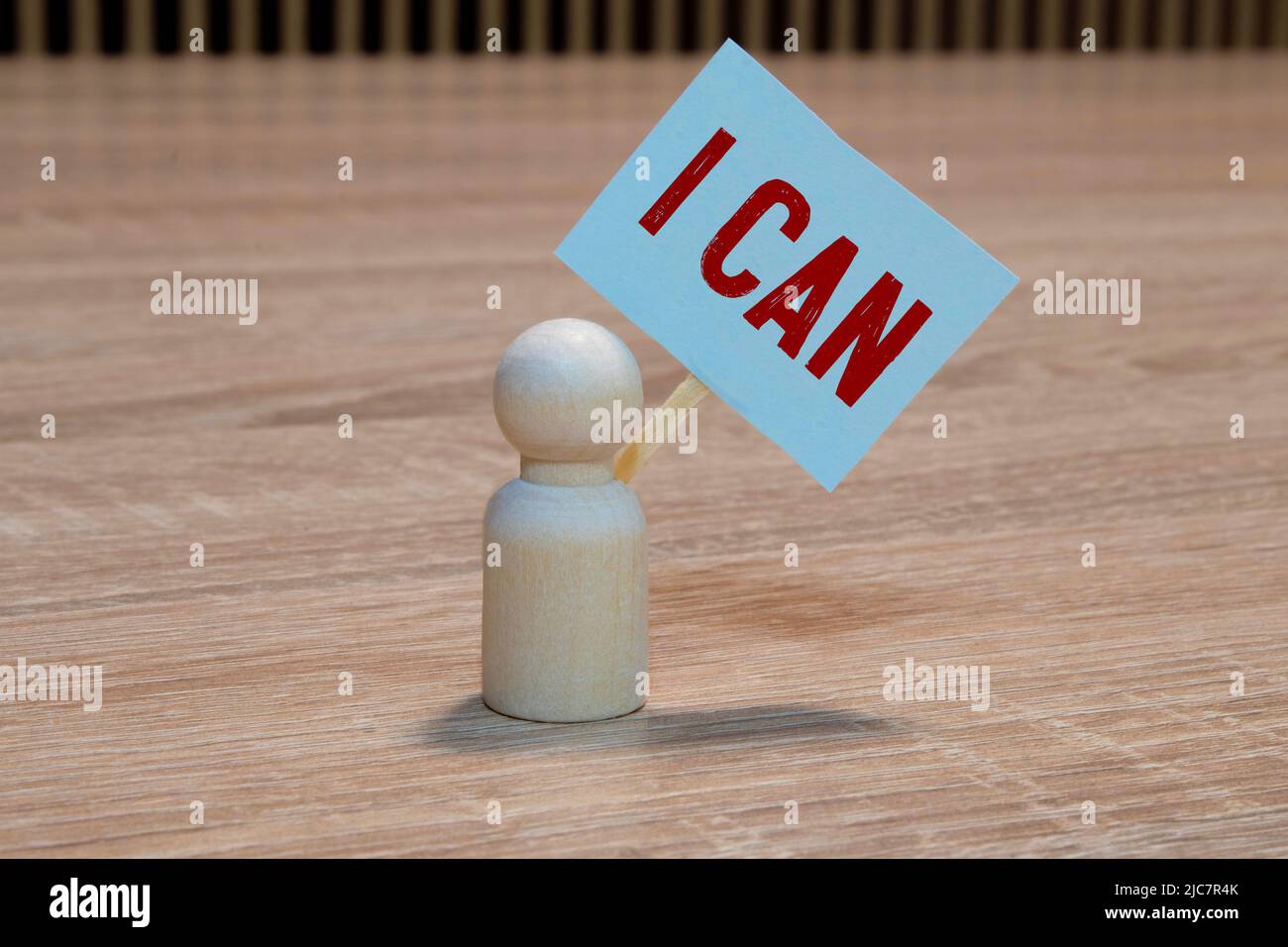 I can inscription on white background appearing behind torn white paper ...