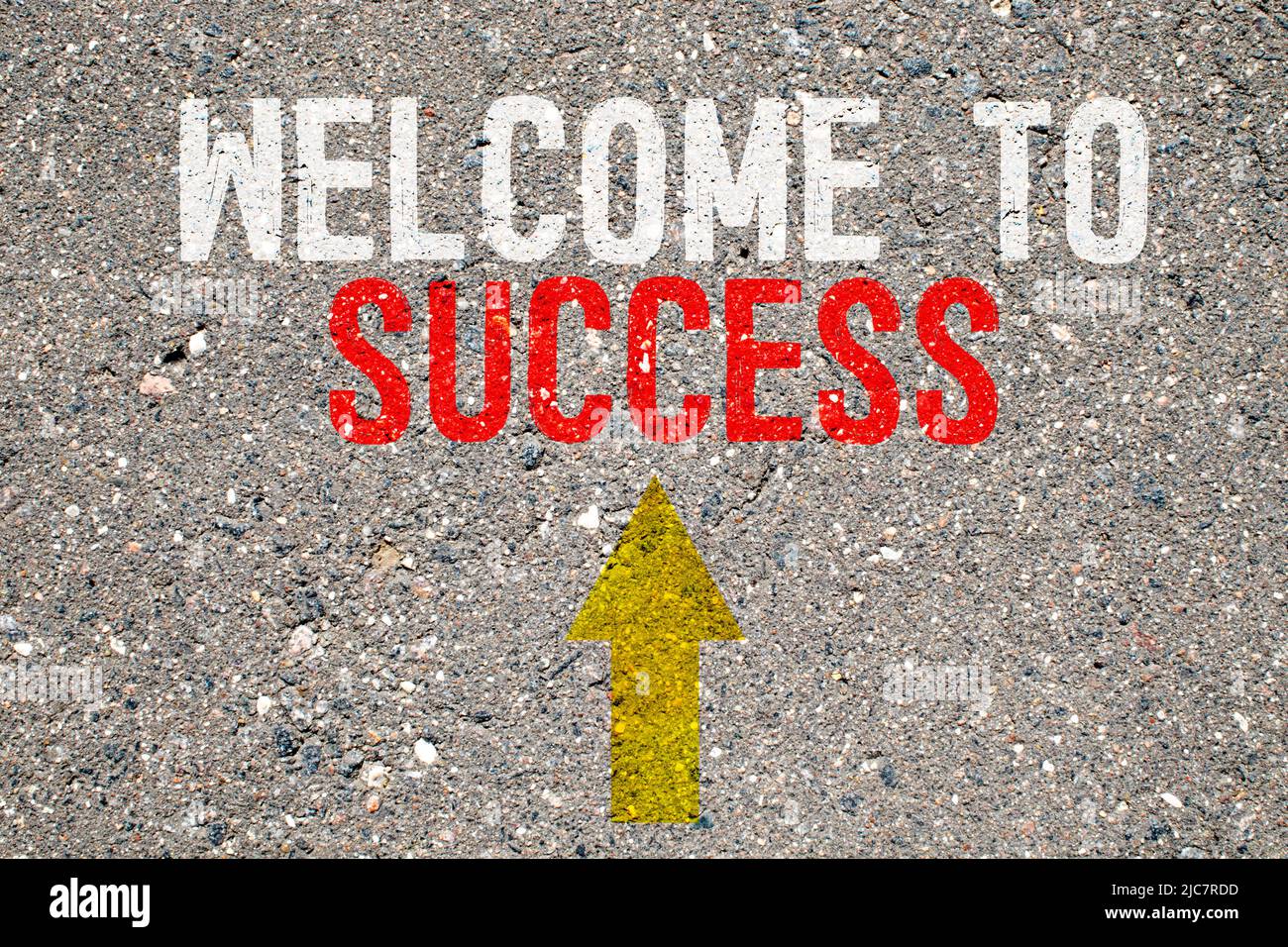 Business concept. On the asphalt road markings an arrow with the ...