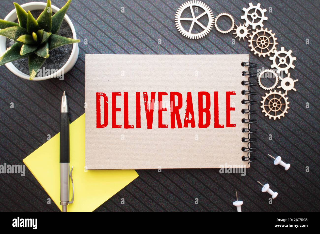 Modern business buzzword - deliverable. Top view on keyboard and puzzle ...