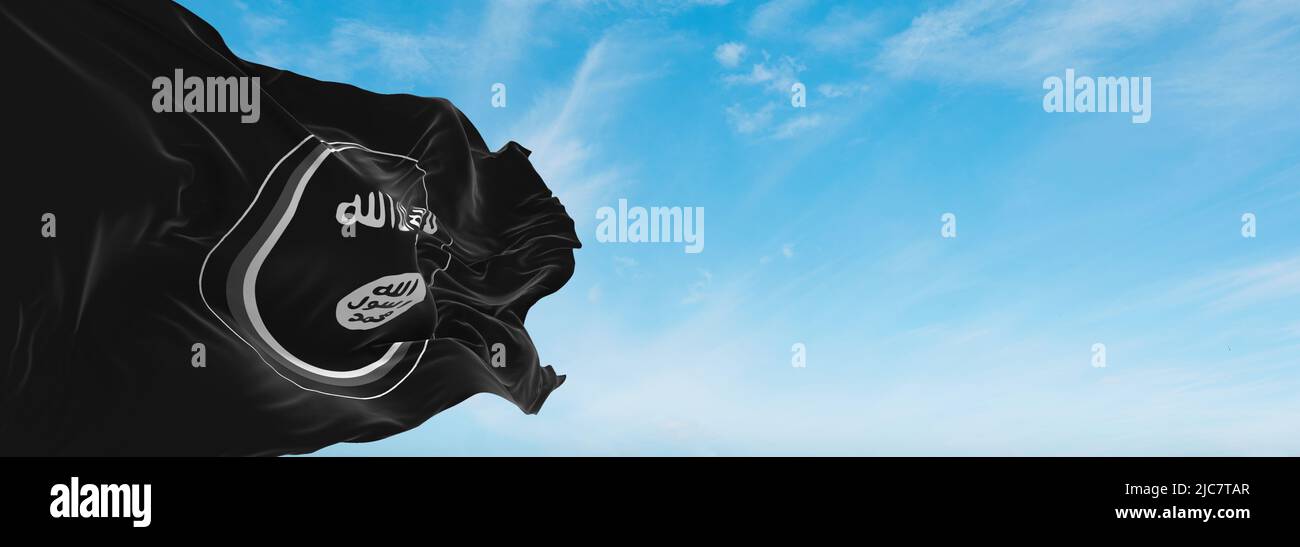 official flag of Easternn Mujahideen Indonesia at cloudy sky background ...