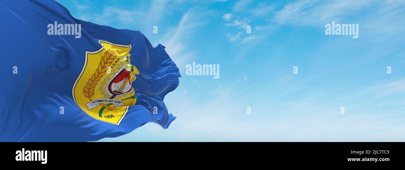 official flag of Kupang City Indonesia at cloudy sky background on ...