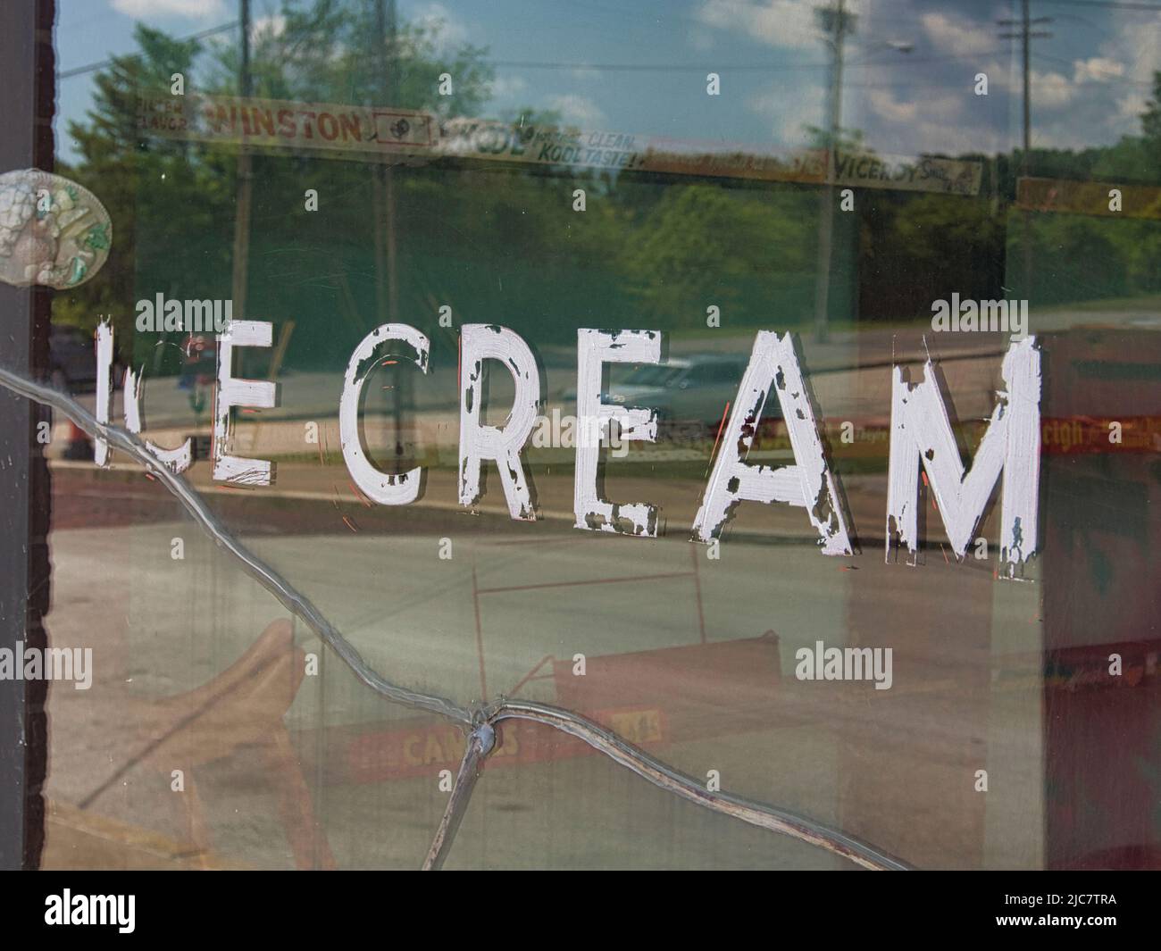 Ice cream sign painted on glass window Stock Photo - Alamy